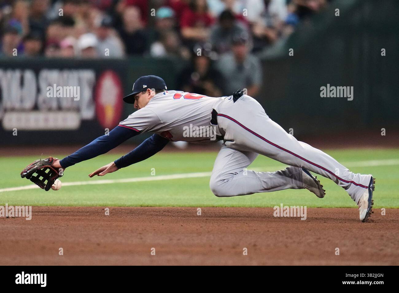Atlanta Braves third baseman Austin Riley dives in vain on a double hit ...