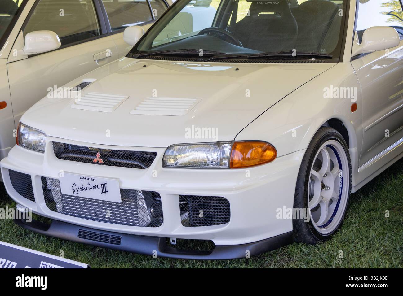 Close up of a white mitsubishi lancer evolution iii, highlighting its ...