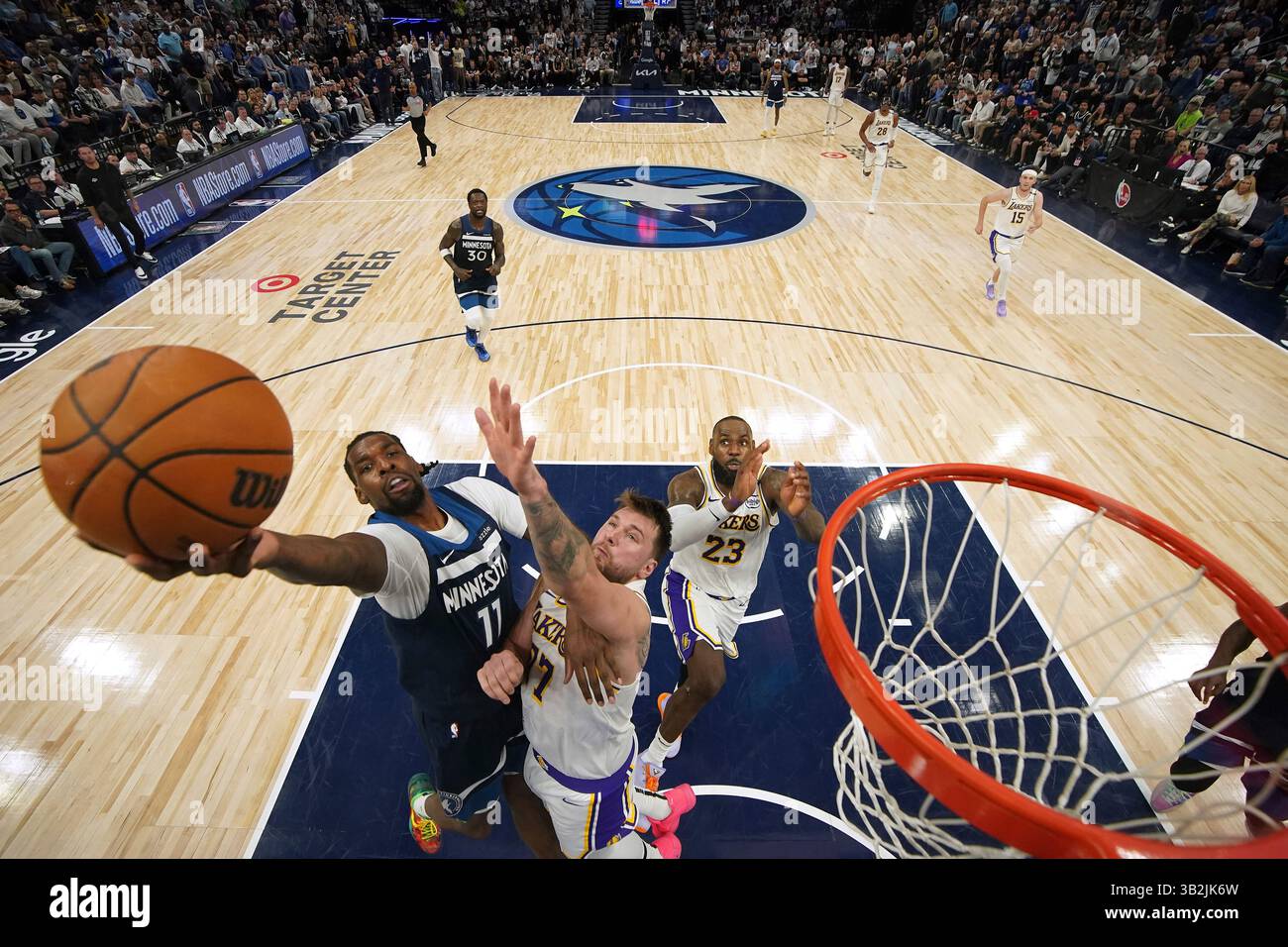 Minnesota Timberwolves center Naz Reid (11) shoots over Los Angeles ...