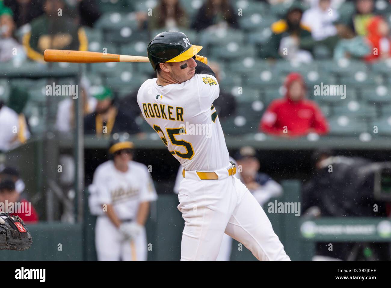 Athletics' Brent Rooker hits a single during the third inning of a ...