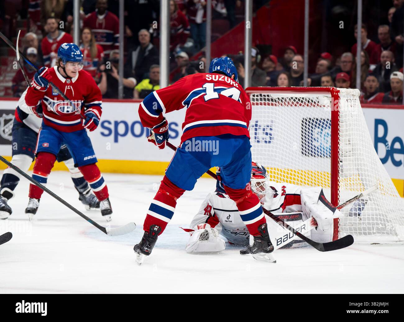 Washington Capitals goaltender Logan Thompson, bottom right, makes a save against Montreal ...