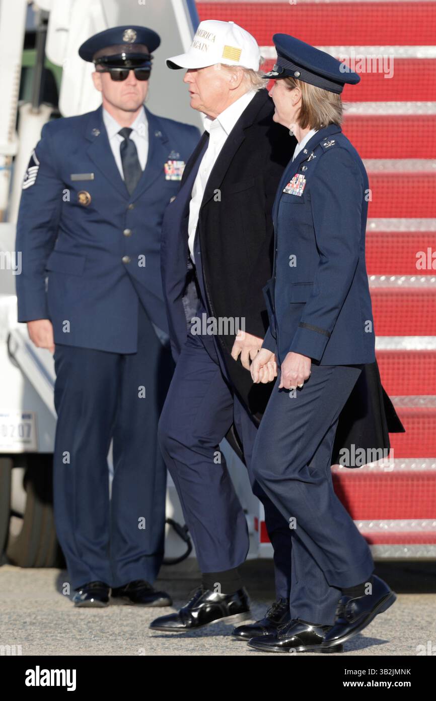 President Donald Trump, center, talks with Air Force Col. Angela F ...