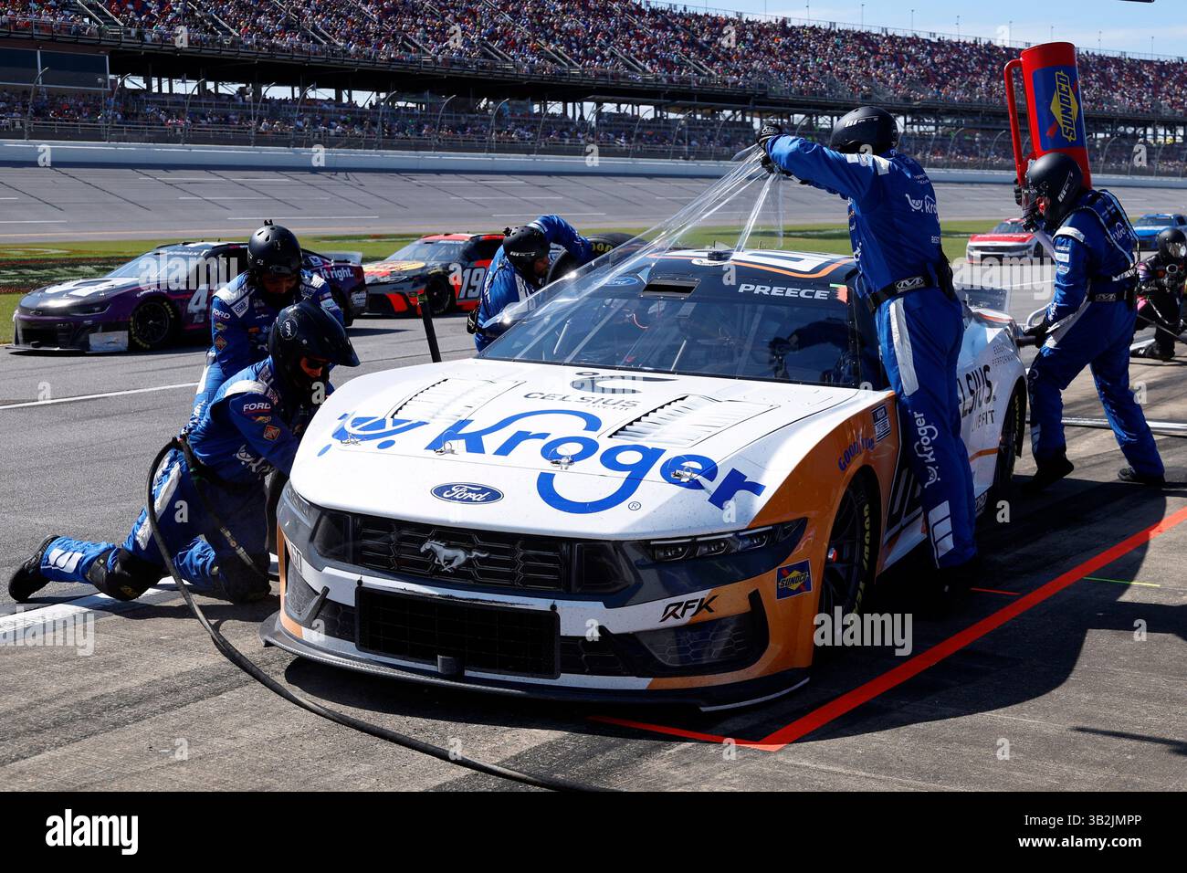 Crew members changes tires for Ryan Preece during a NASCAR Cup Series ...
