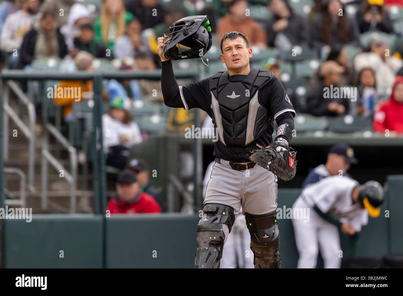 Chicago White Sox catcher Matt Thaiss returns to the plate after a foul ...