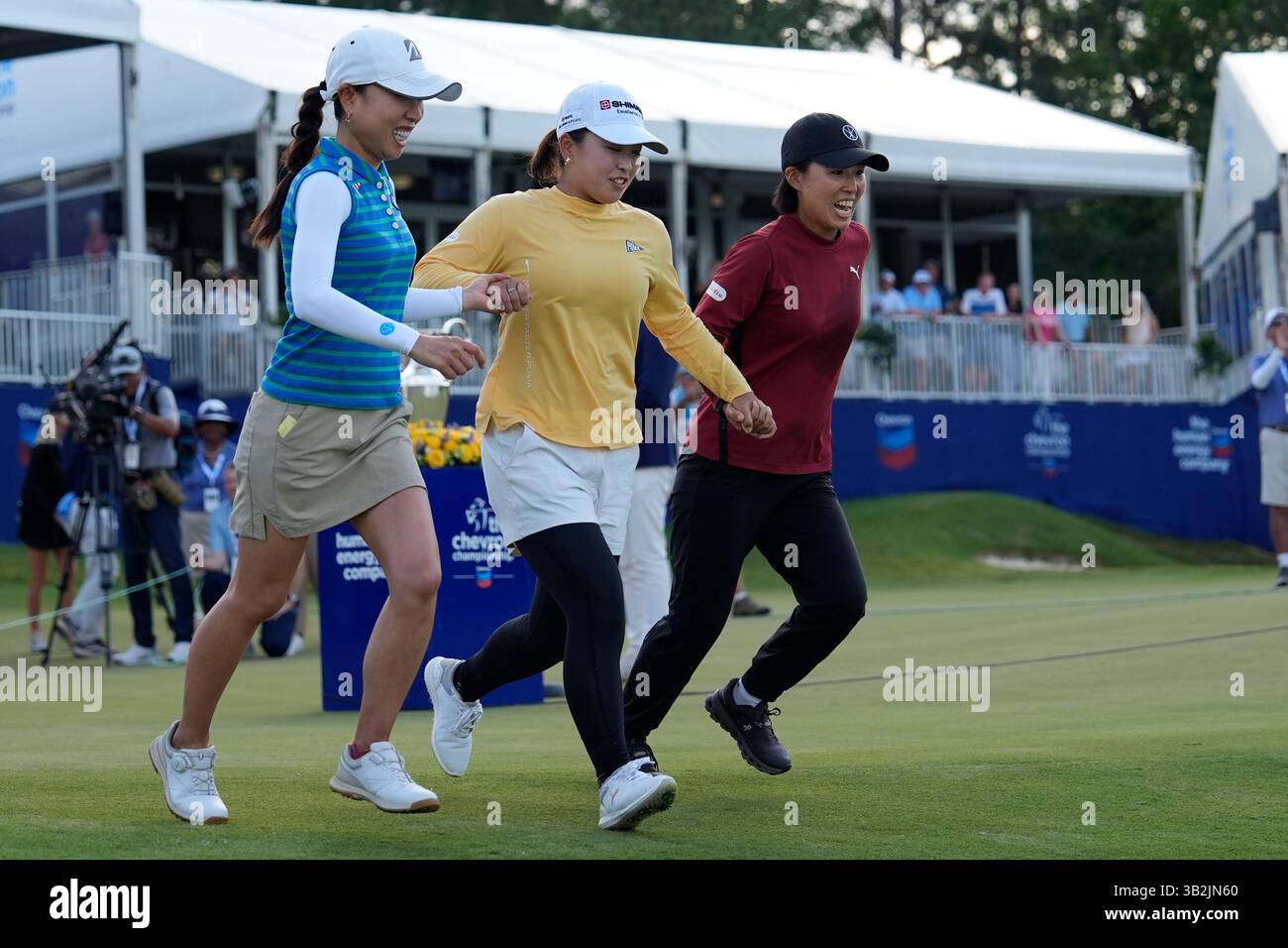 Mao Saigo, of Japan, in yellow, prepares to dive into the water off the ...