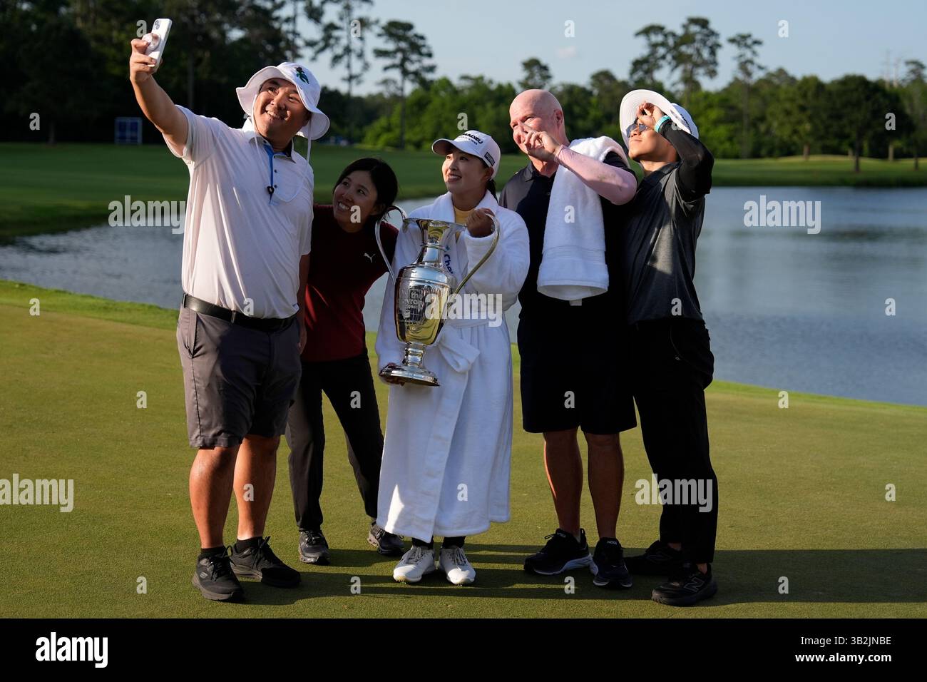 Mao Saigo, of Japan, celebrates with her team after winning the Chevron ...