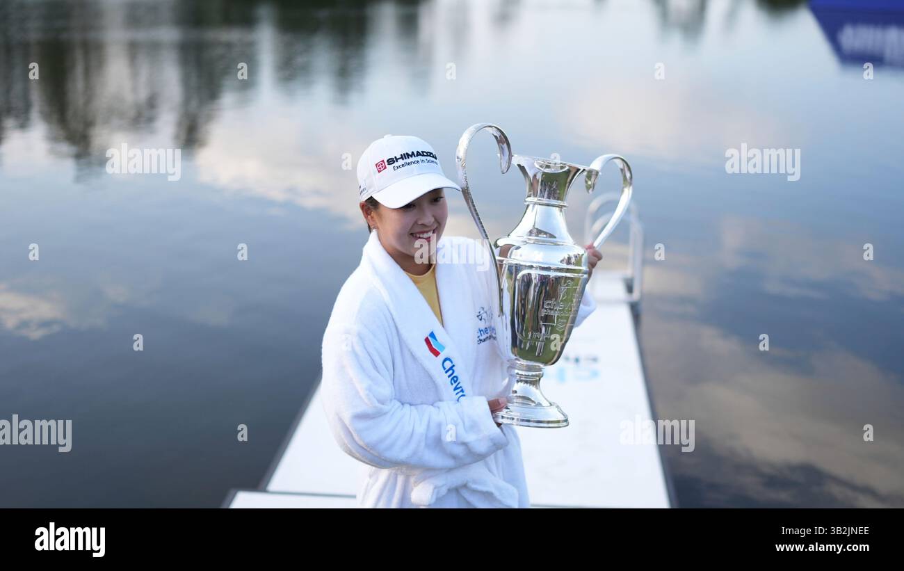 Mao Saigo, of Japan, poses with the trophy after winning the Chevron ...