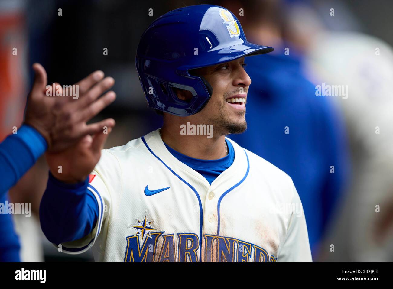 Seattle Mariners' Leo Rivas is congratulated in the dugout after ...