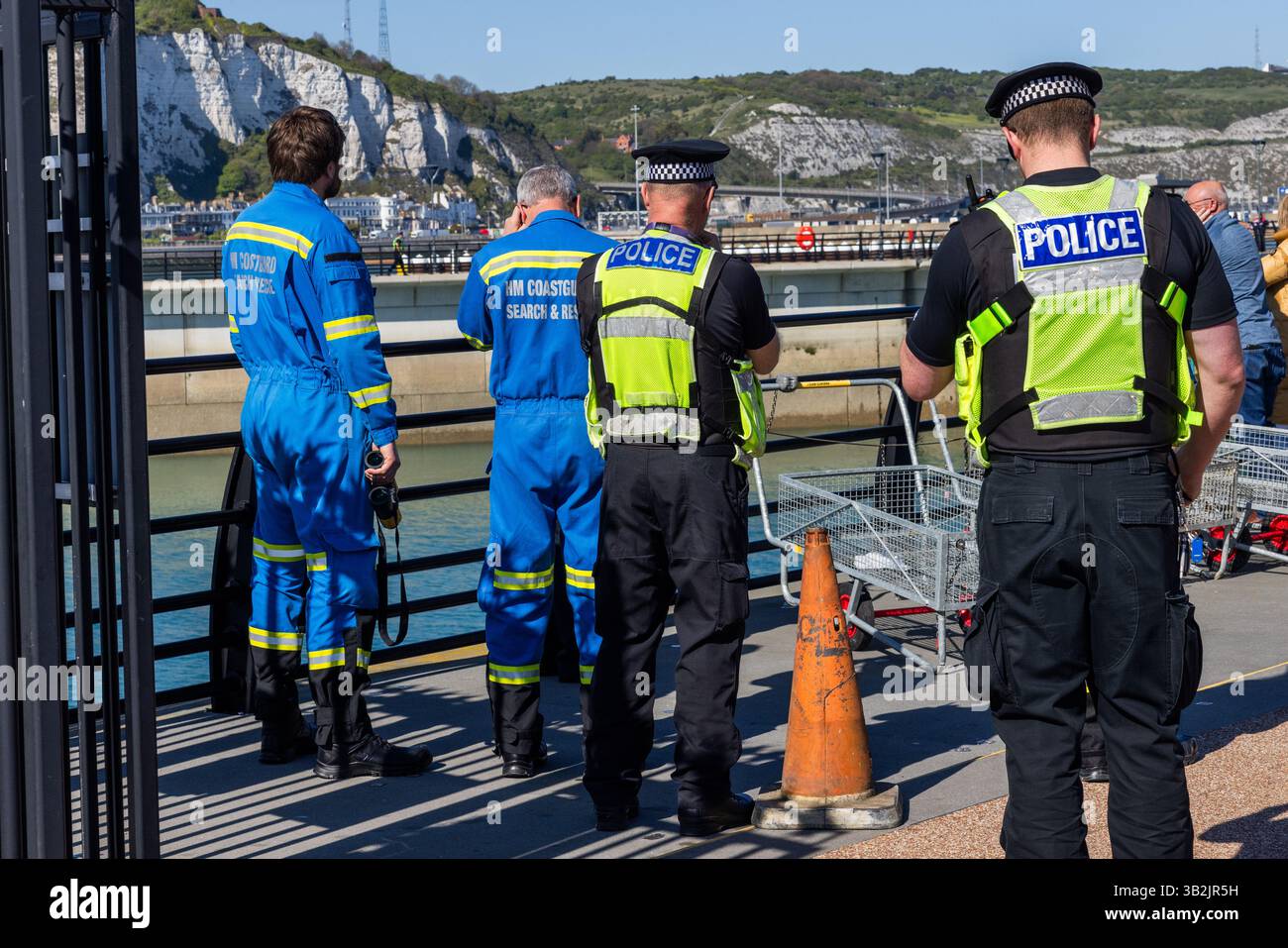 Dover, UK. 27 APR, 2025. Police stand with HM Coastguard staff at the ...