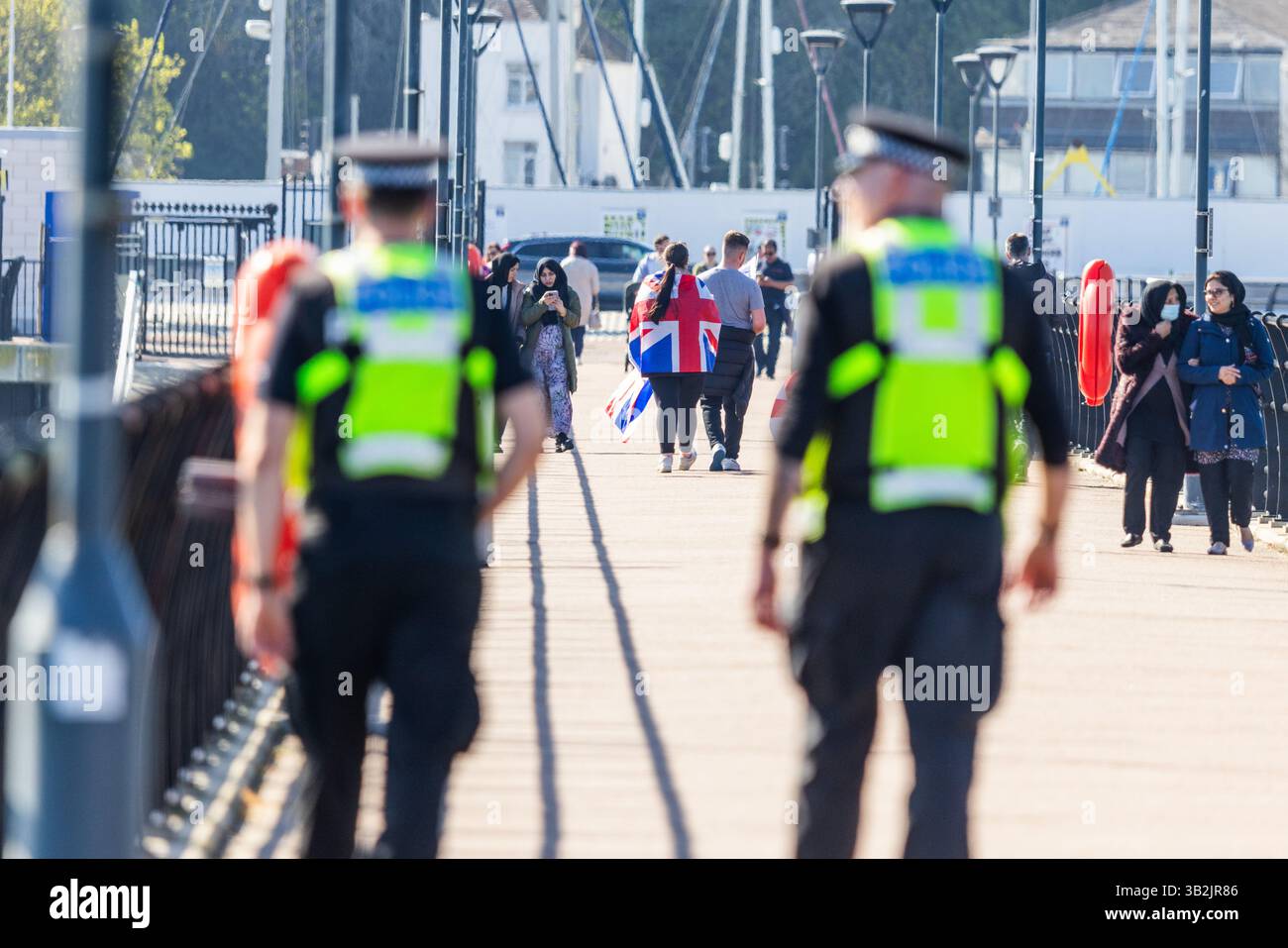 Dover, UK. 27 APR, 2025. Person wearing an Union Jack flag walks down a ...