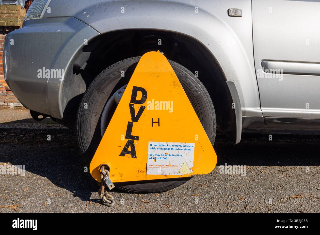 Dover, UK. 27 APR, 2025. Car with DVLA road clamp on a backstreet in ...