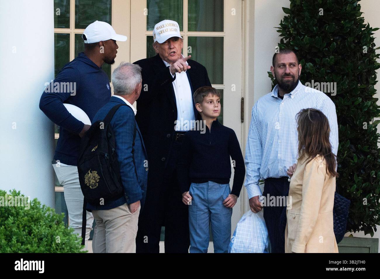 President Donald Trump with his grandson, Theodore Kushner, fourth from ...