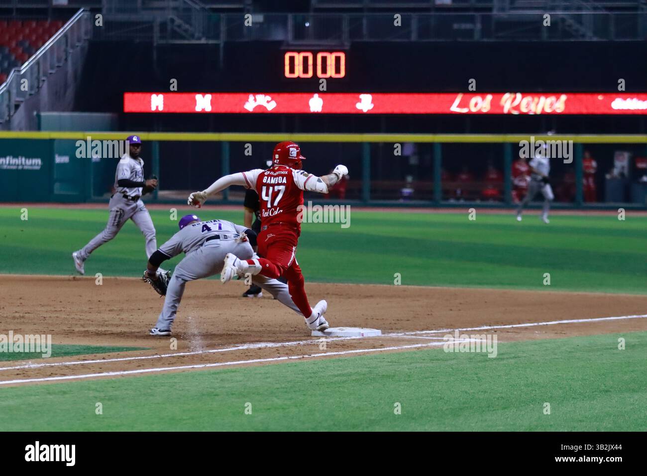Juan Carlos Gamboa #47 of Diablos Rojos del Mexico slides to second ...
