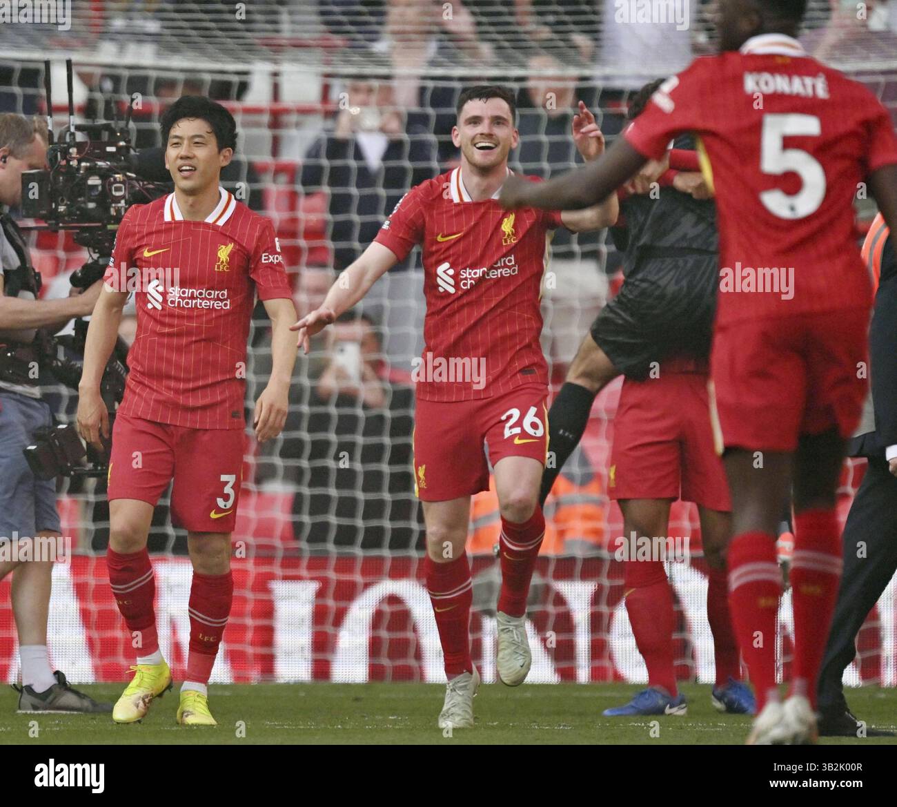 Wataru Endo (3) and other Liverpool players celebrate after the ...