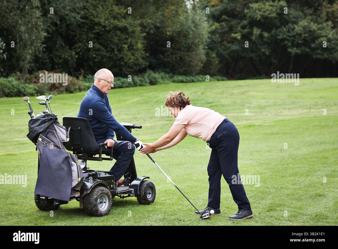 Sports, mobility scooter and people for golf in game, match and competition on golfing course ...