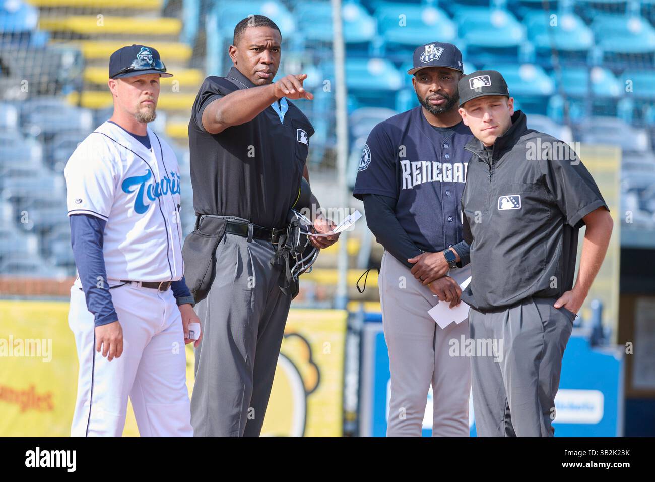 Asheville Tourists manager Nate Shaver (25), home plate umpire David ...