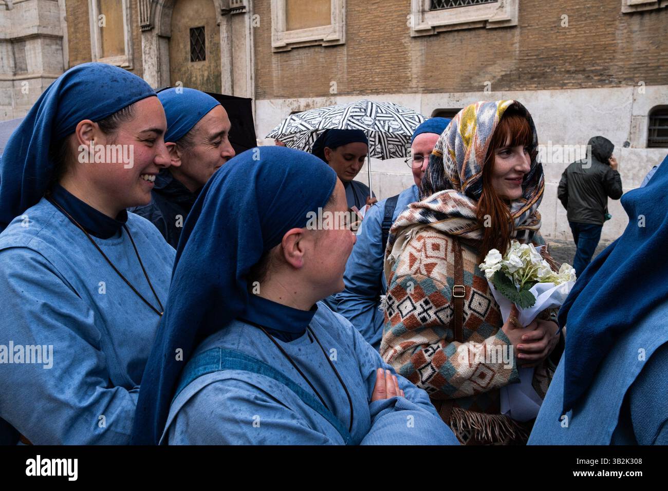 Nuns wait in line to visit the tomb of Pope Francis at the Basilica of ...
