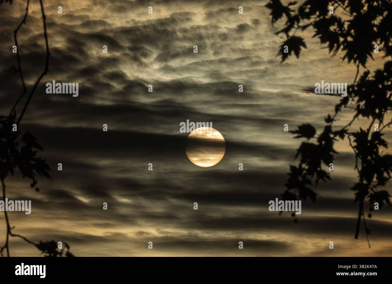 Day Turned Night: Sun Hidden by Spring Clouds Stock Photo - Alamy