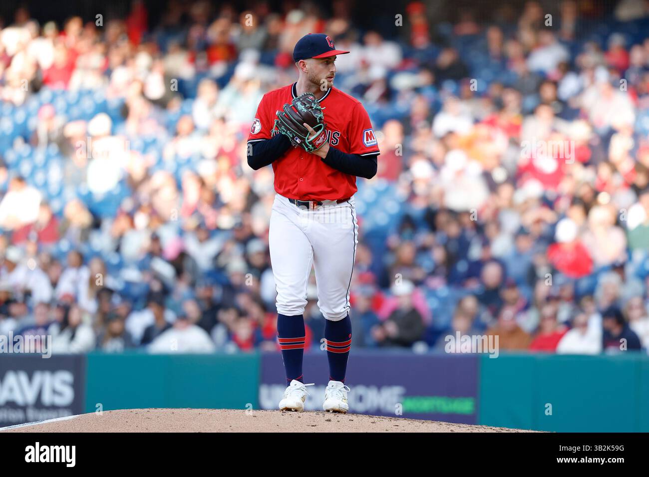 Tanner Bibee #28 of the Cleveland Guardians prepares to throw a pitch ...