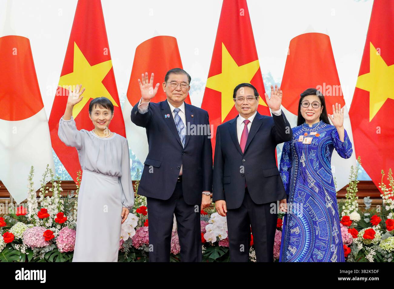 Vietnamese Prime Minister Pham Minh Chinh, second right, and his wife Le Thi Bich Tran, Japanese ...