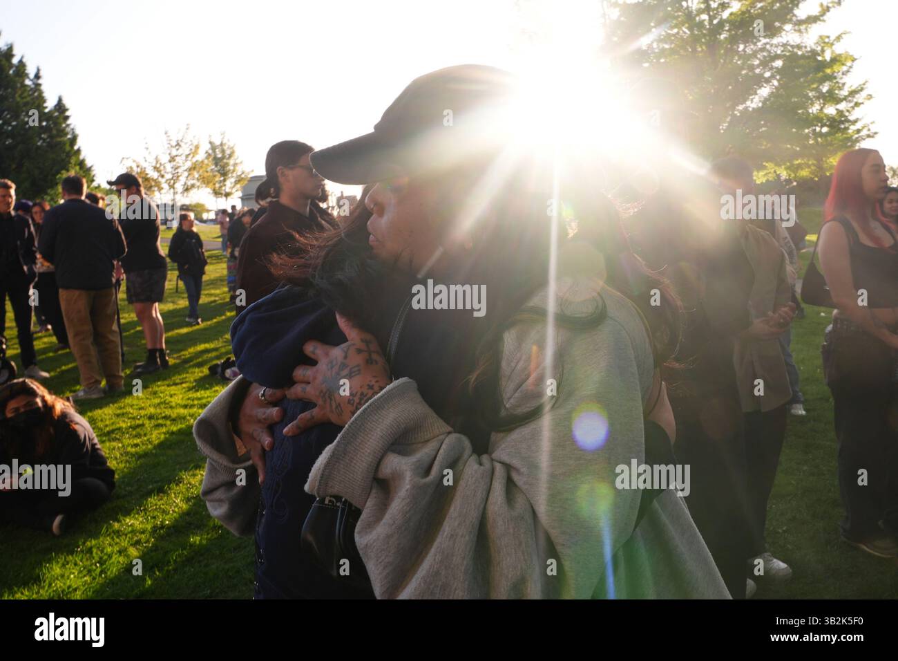 Kayla Vargas, right, hugs Mikkaela Valencia during a vigil at ...