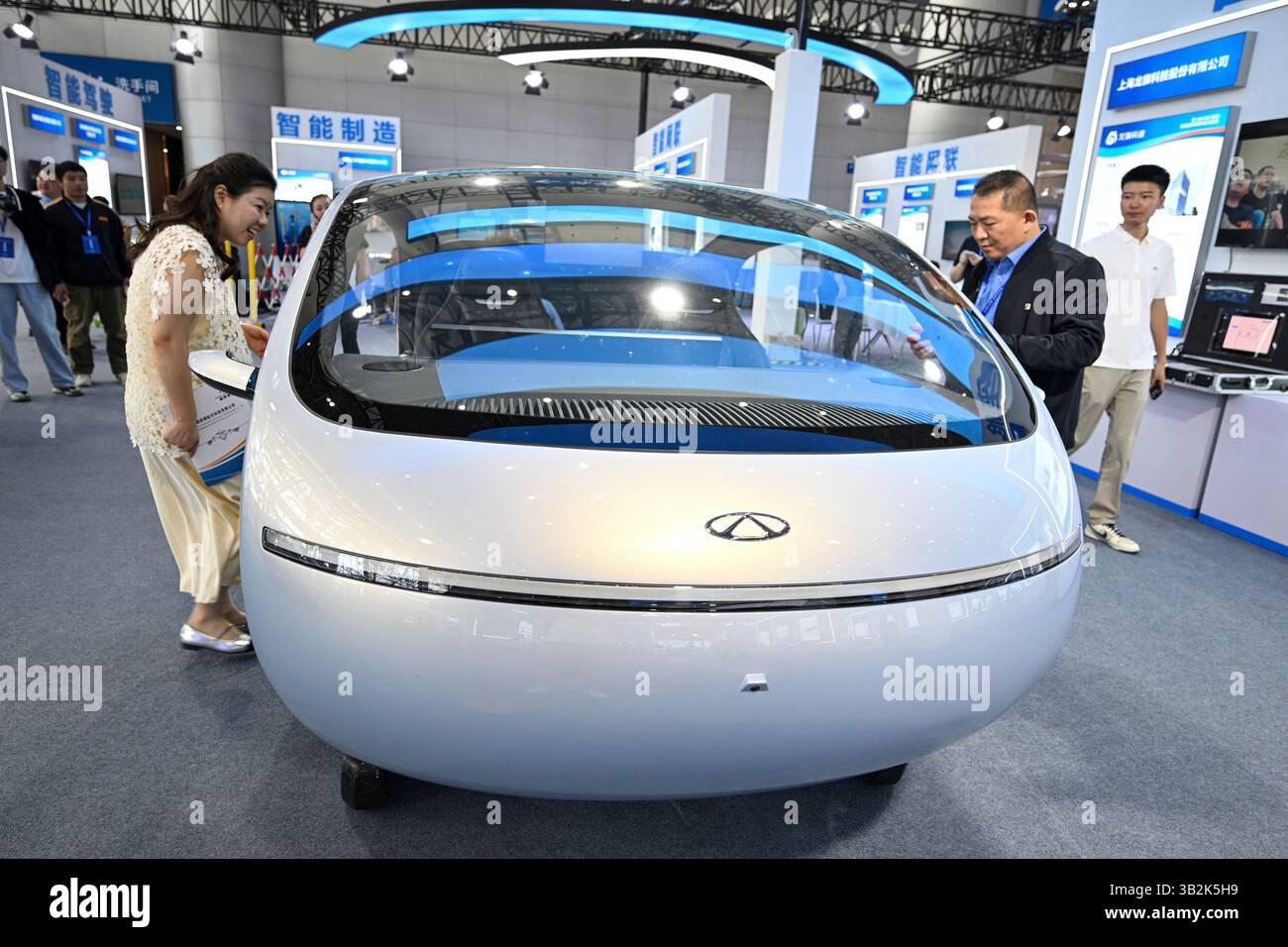 Visitors check out a smart car cabin developed by Chinese carmaker ...