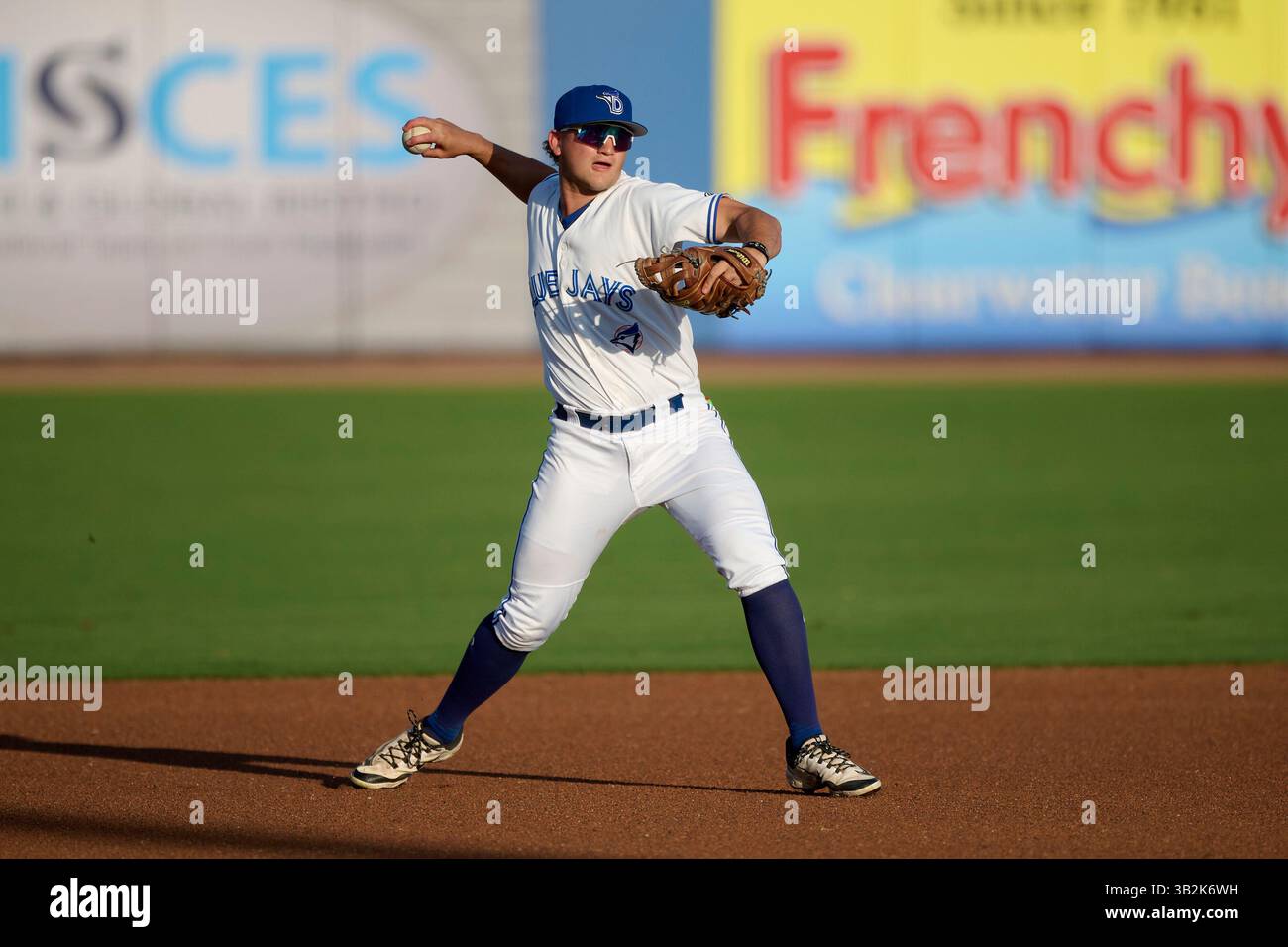 Dunedin Blue Jays third baseman Tucker Toman (8) throws to first base ...