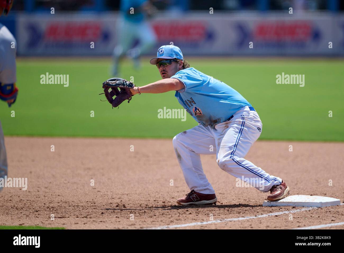 Dunedin Blue Jays second baseman Sam Shaw (4) stretches for a throw while covering first base ...