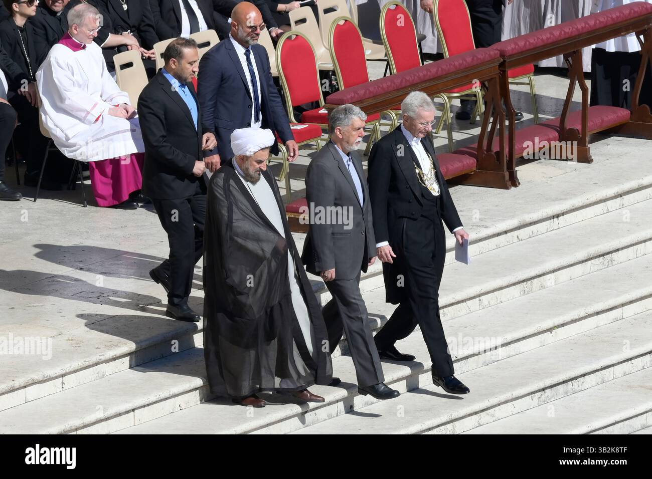 Seyed Abbas Salek Shariati (c) arrives to attend the funeral ceremony ...