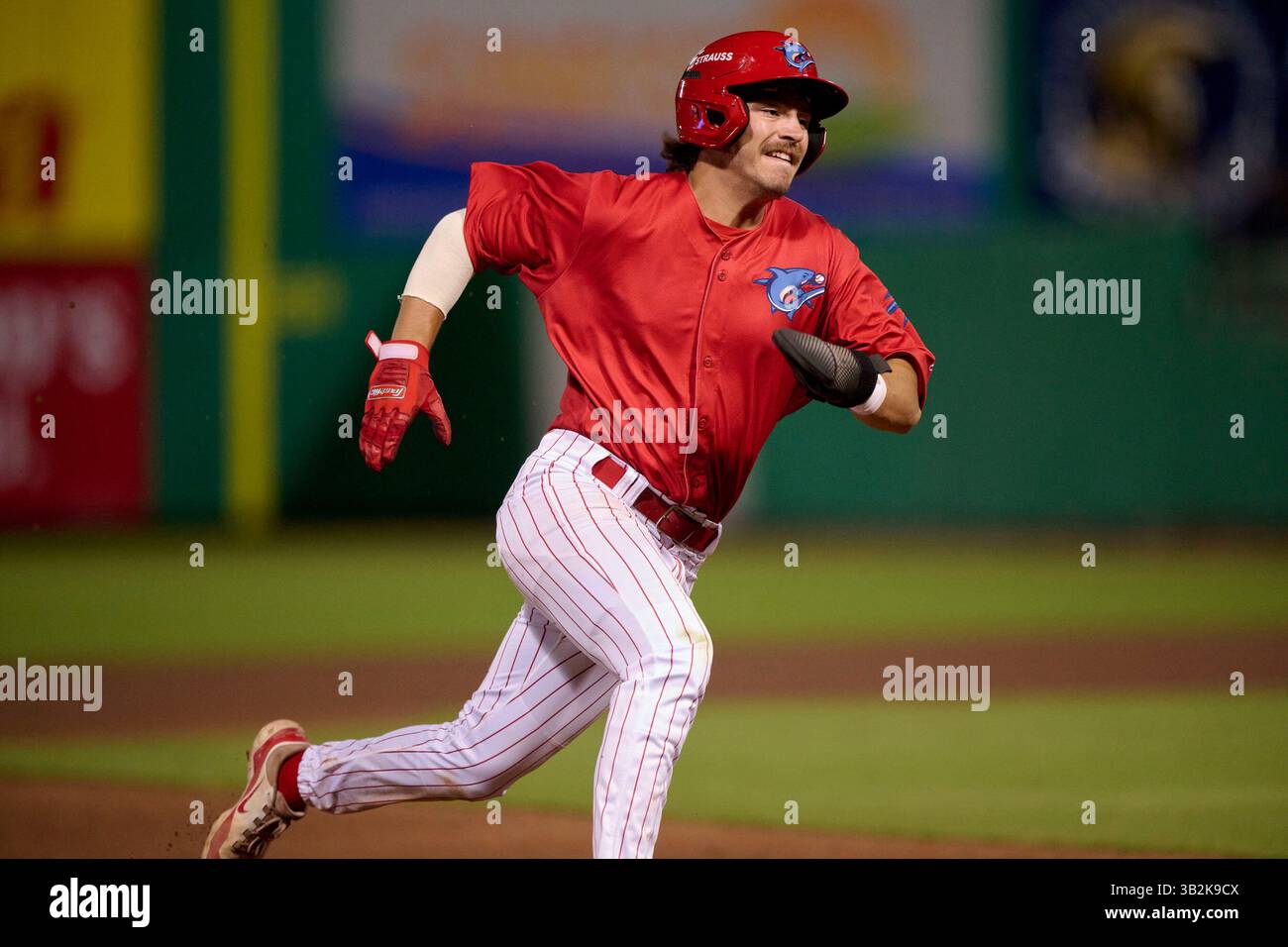 Clearwater Threshers Brady Day (10) rounds third base to score the game ...