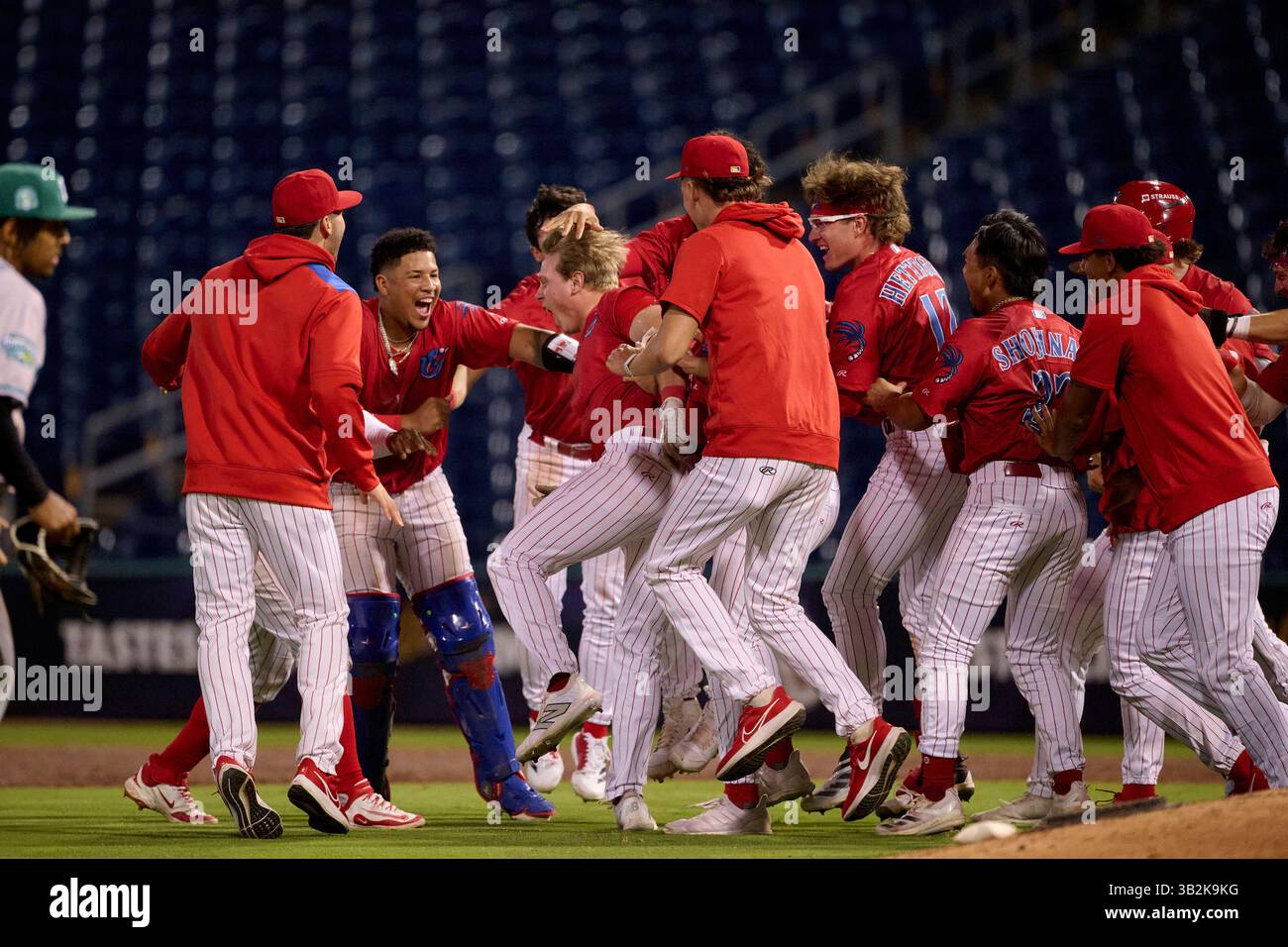 Clearwater Threshers Joel Dragoo (7) is mobbed by teammates after ...