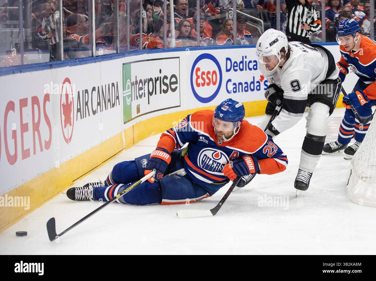 Los Angeles Kings' Adrian Kempe (9) trips up Edmonton Oilers' Leon ...