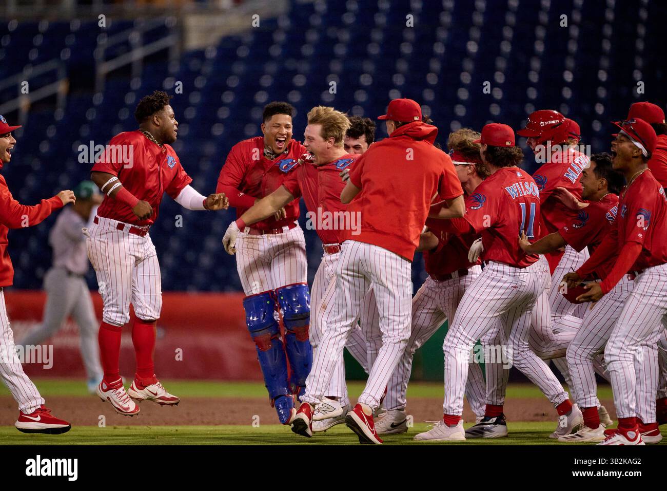 Clearwater Threshers Joel Dragoo (7) is mobbed by teammates after ...