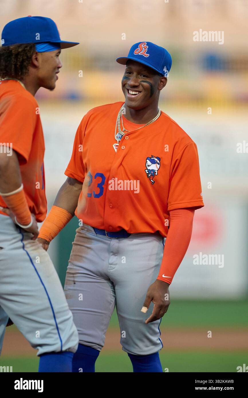 St. Lucie Mets second baseman Jesus Baez (23) jokes with third baseman ...