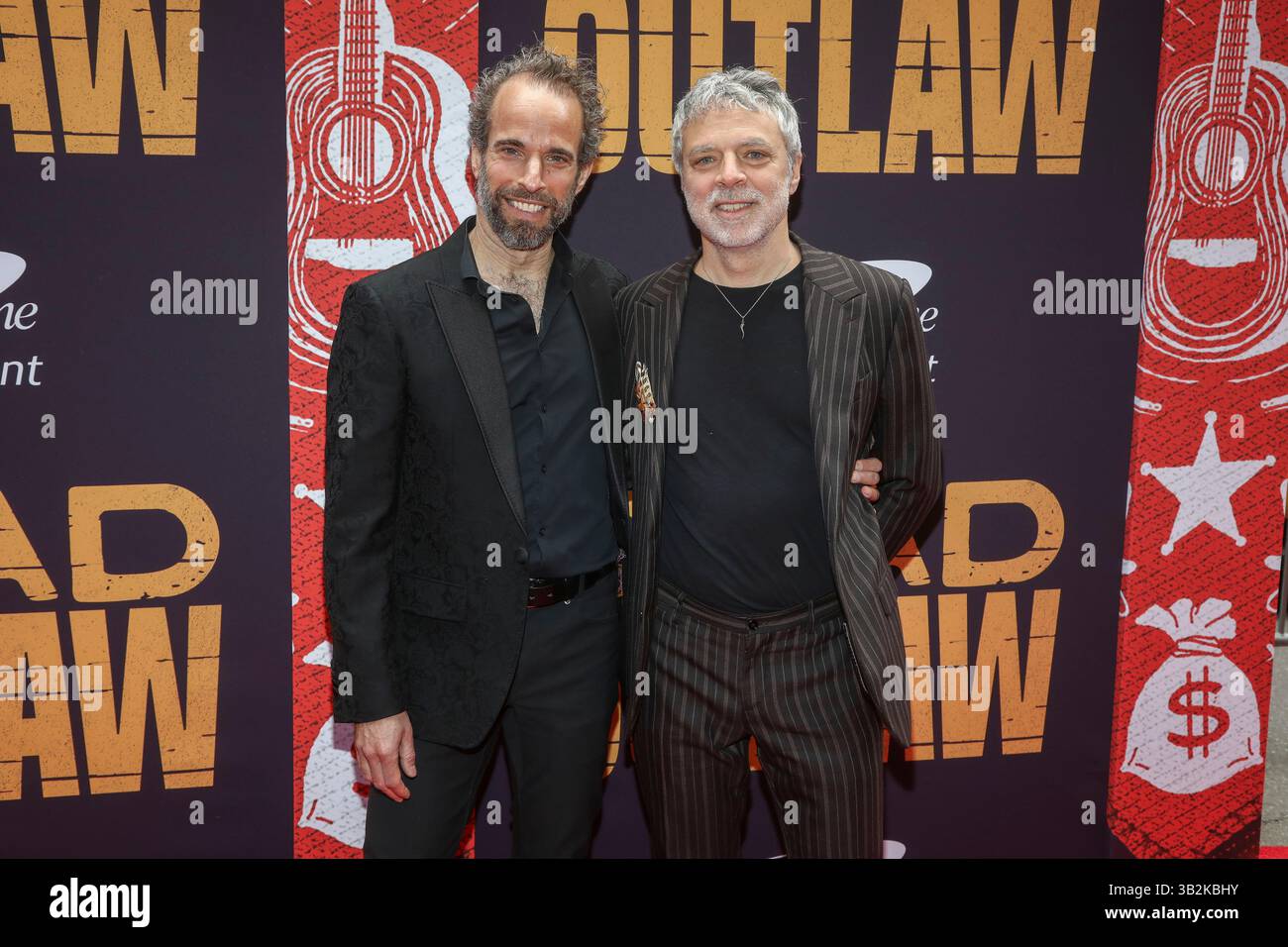 Orchestrator Dean Sharenow, left, and composer Erik Della Penna attends ...