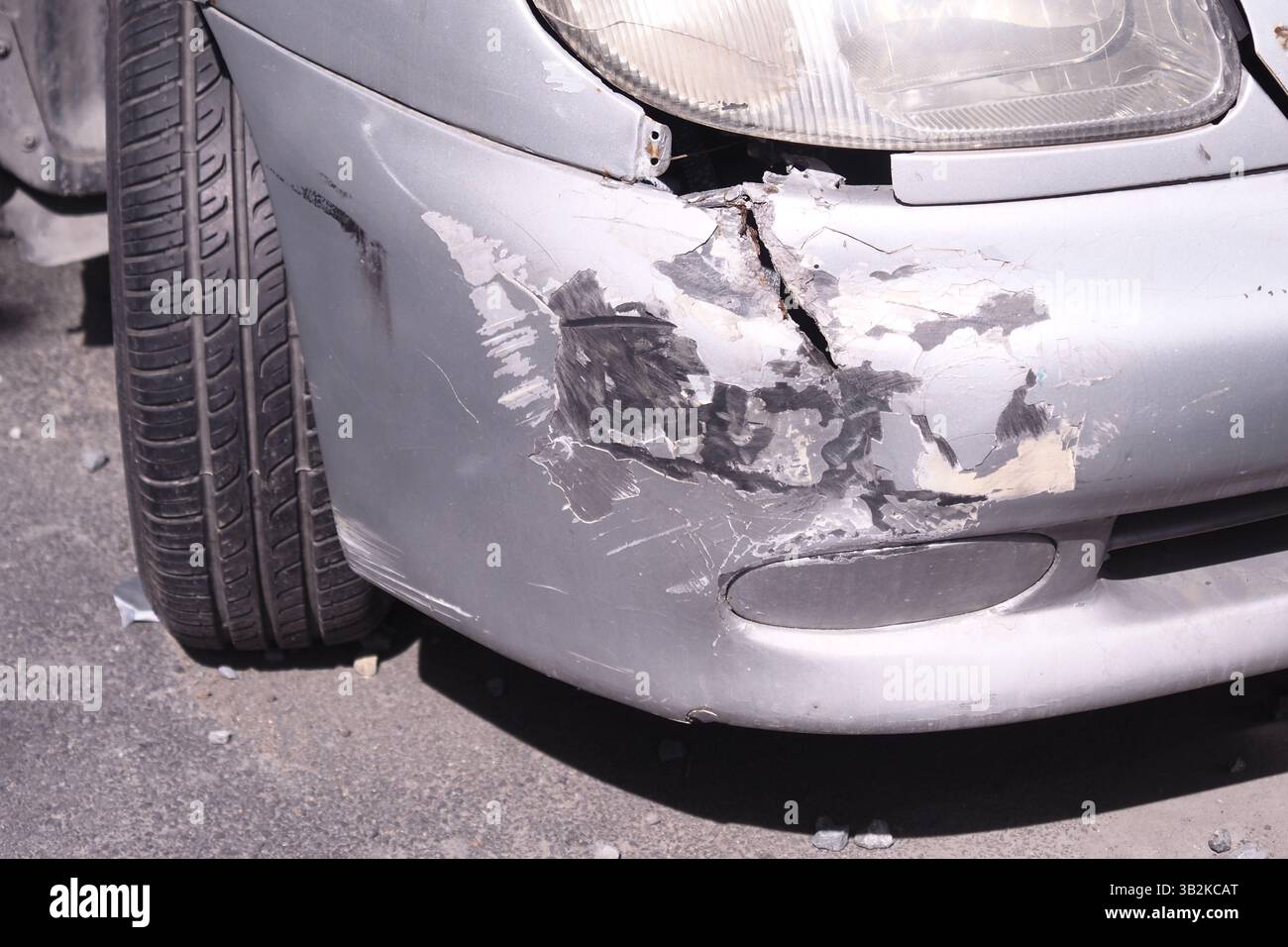 Car with significant damage parked on the roadside during daytime Stock ...