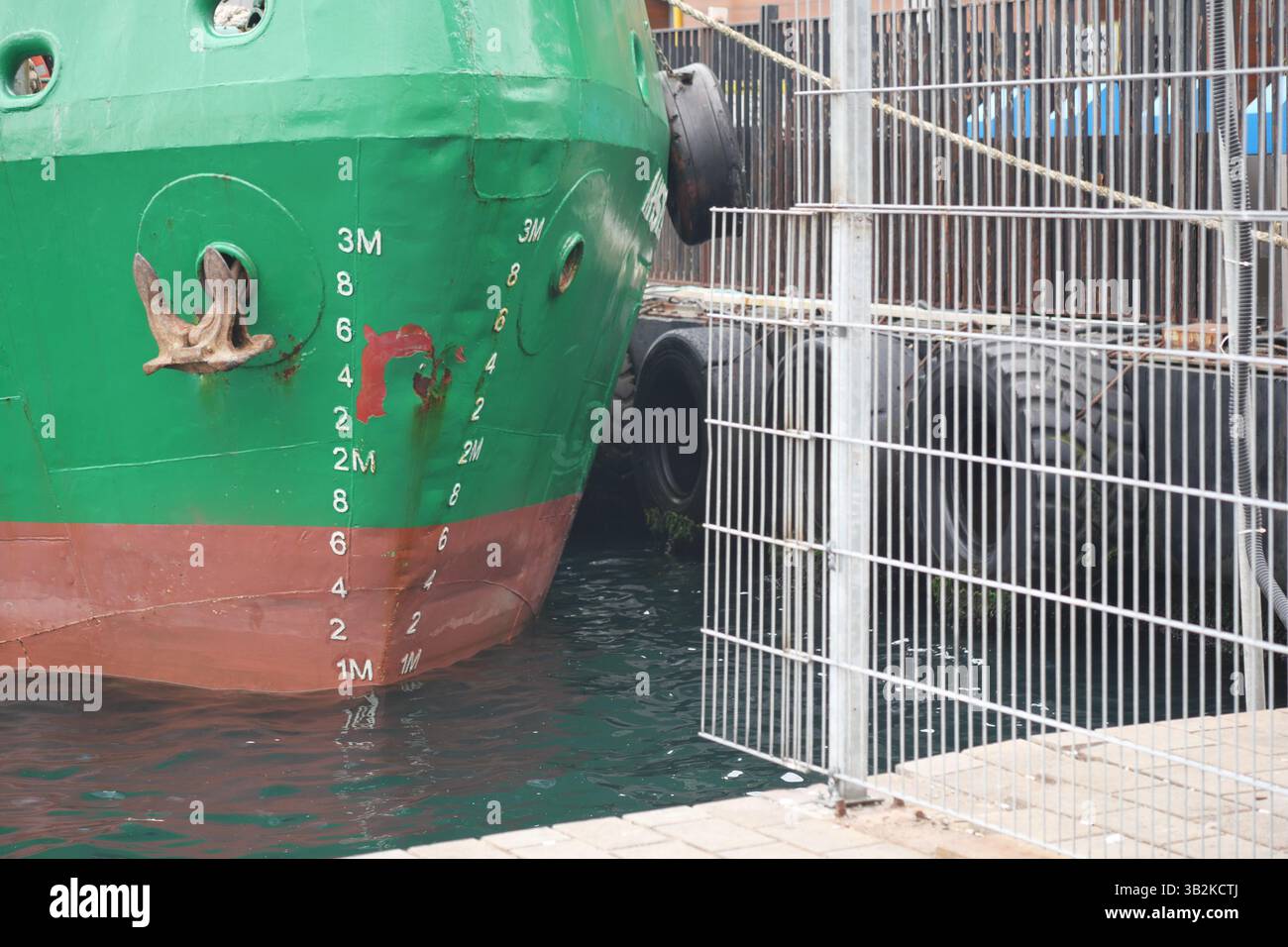 Colorful ship docked at waterfront with visible markings Stock Photo ...