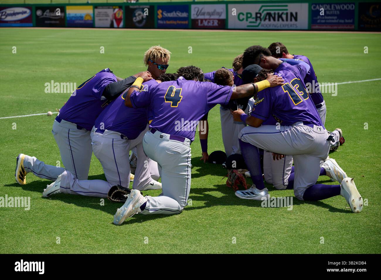 Fort Myers Mighty Mussels players huddle before an MiLB Florida State ...