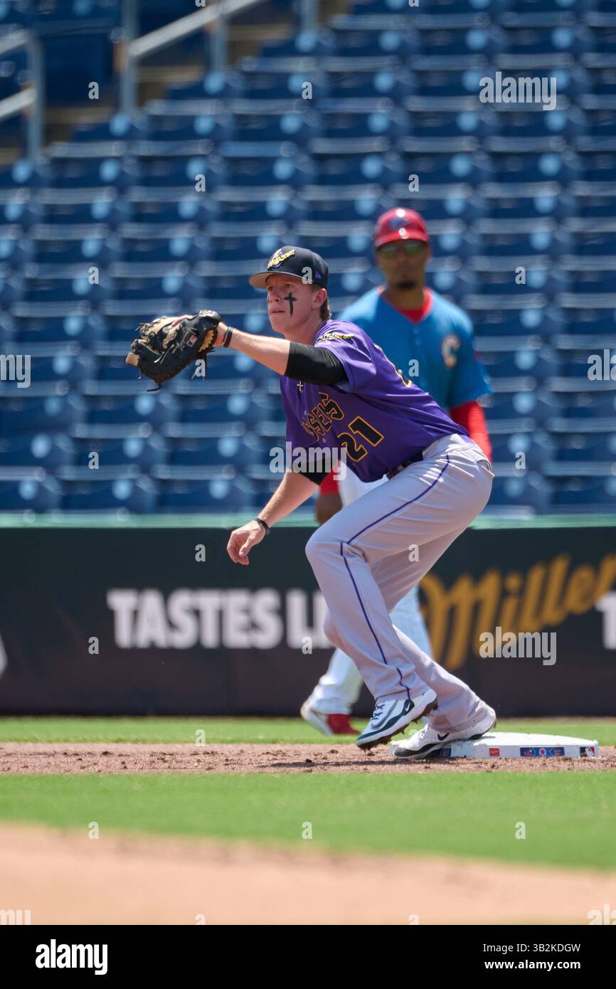 Fort Myers Mighty Mussels first baseman Peyton Carr (21) stretches for ...