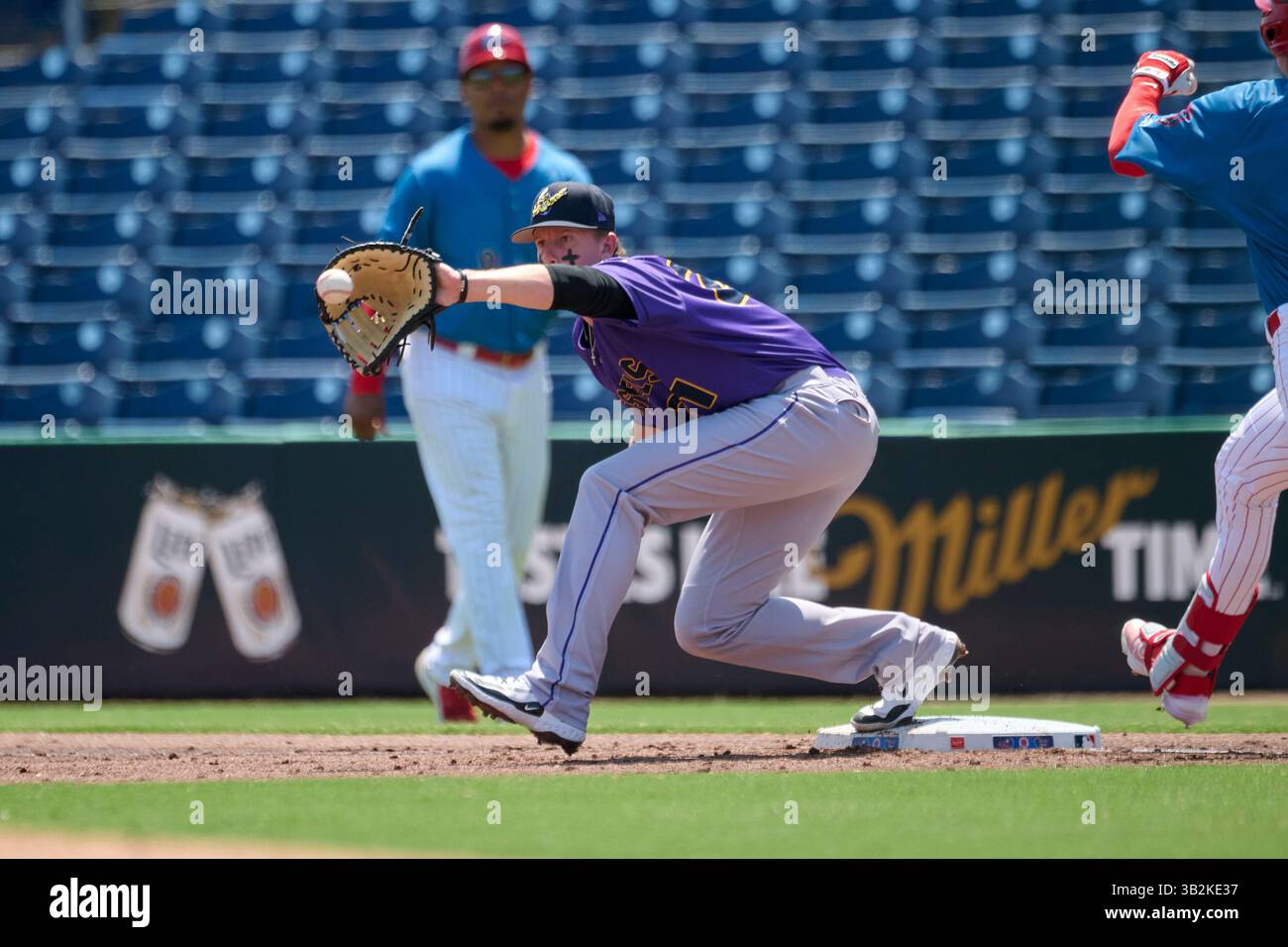 Fort Myers Mighty Mussels first baseman Peyton Carr (21) stretches for ...