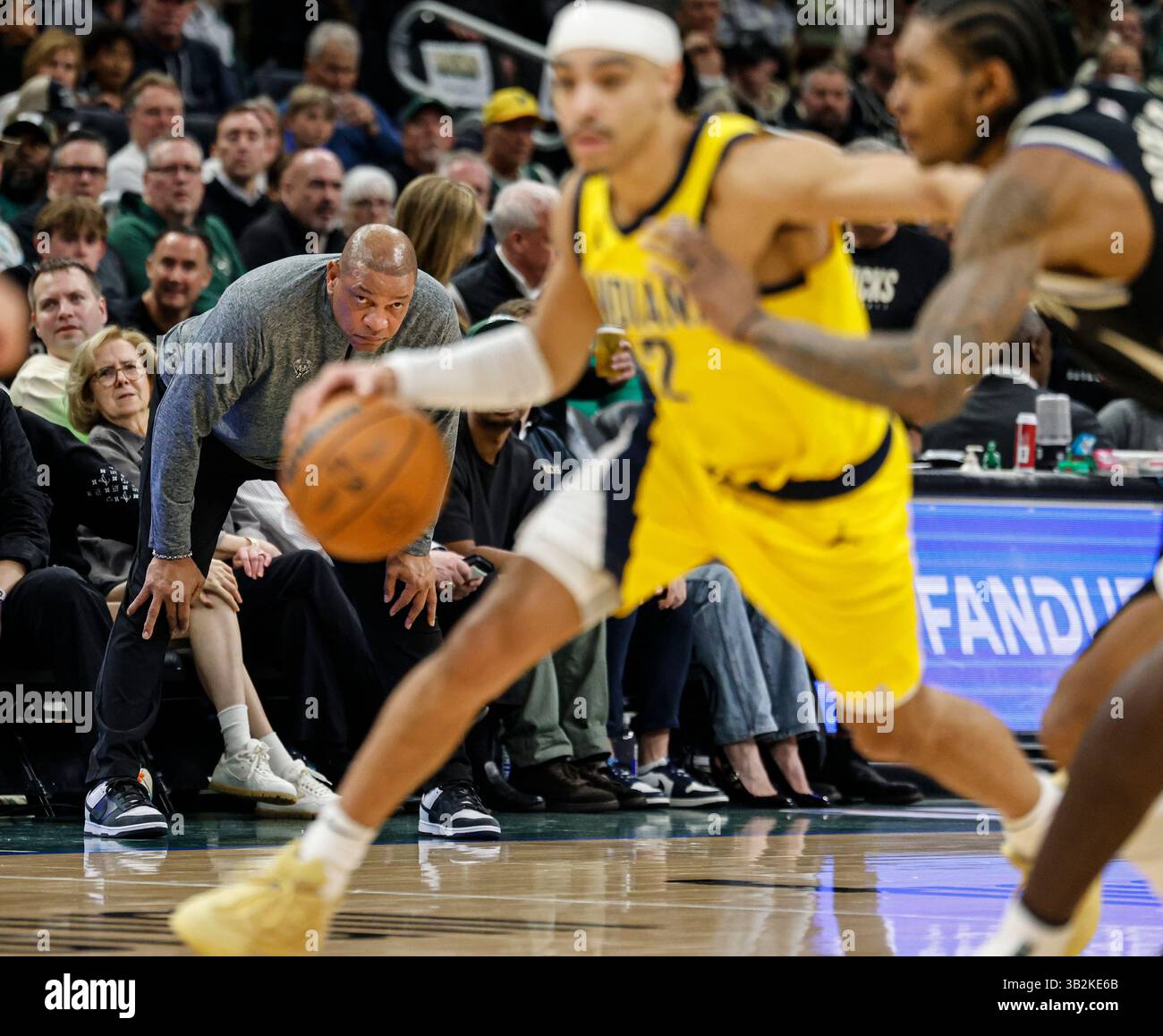 Milwaukee Bucks head coach Doc Rivers, left, looks on during the second ...