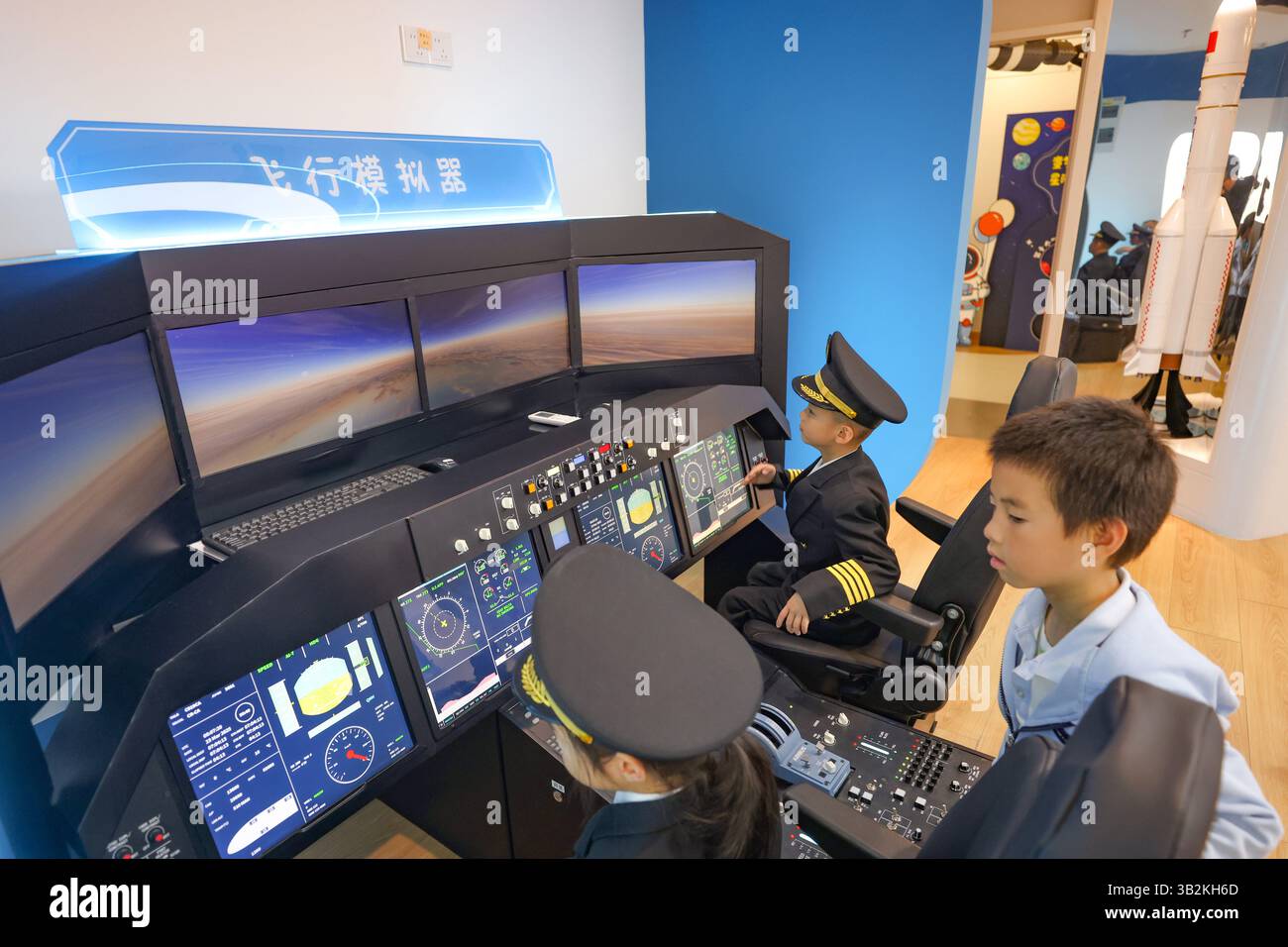 Children experience the flight simulator in the children's aerospace ...