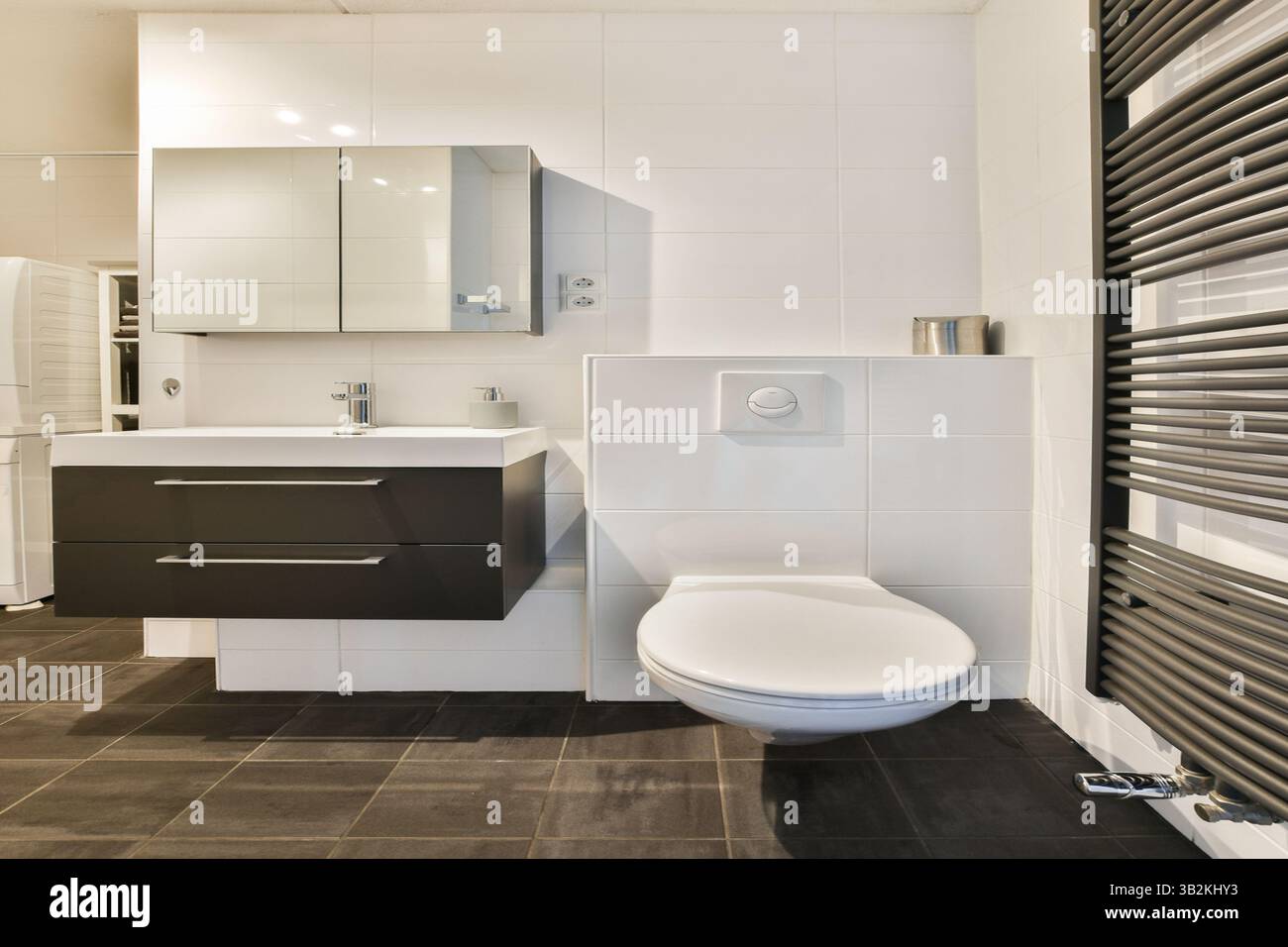 A sleek and contemporary bathroom featuring minimalist fixtures, a ...