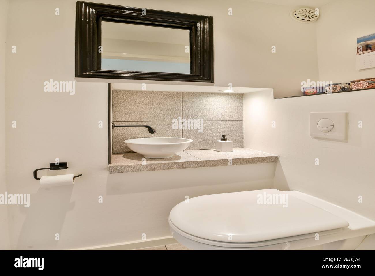 A sleek and modern bathroom featuring a timeless design with clean ...