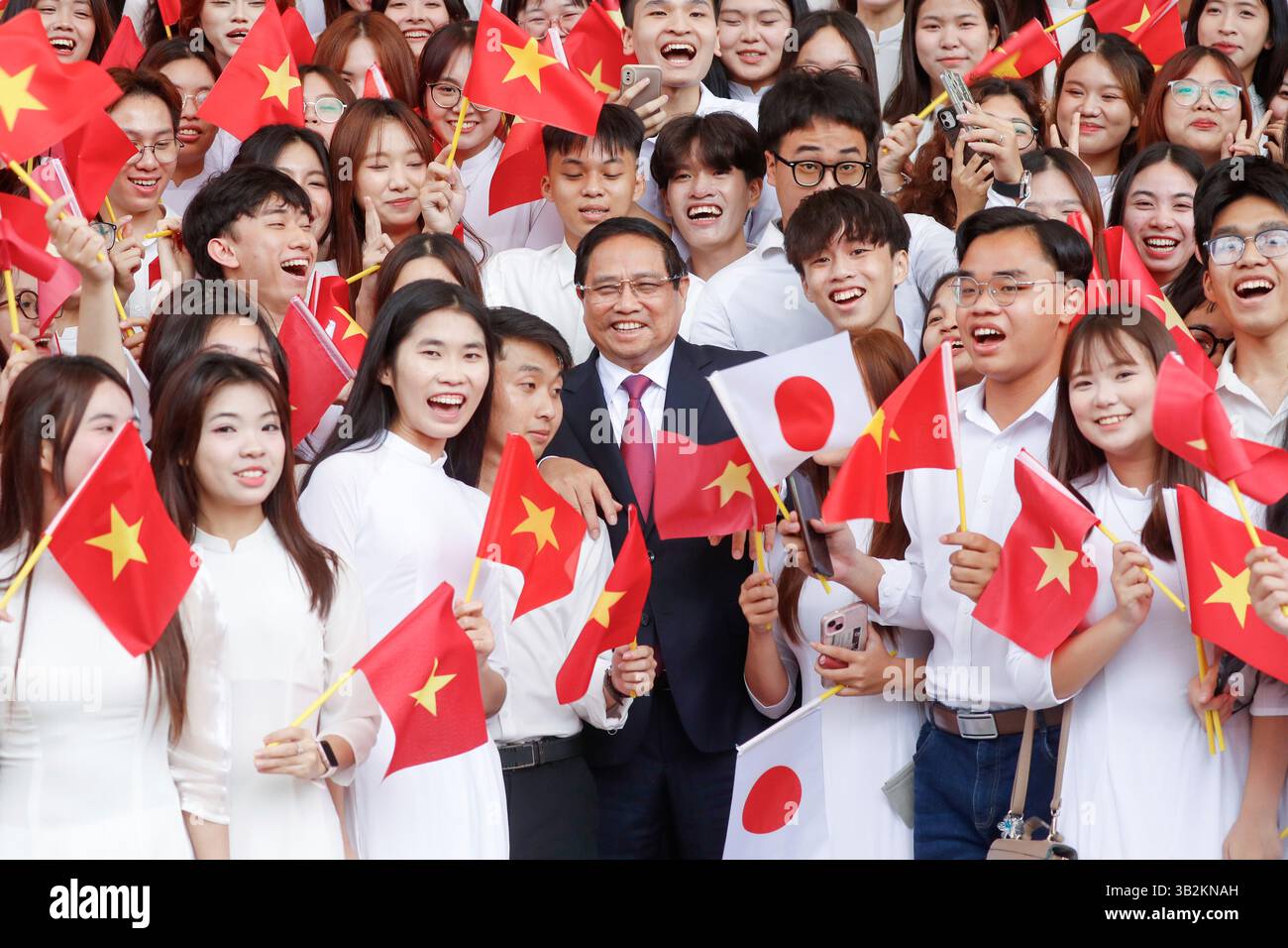 Vietnamese Prime Minister Pham Minh Chinh, center, poses for a group ...