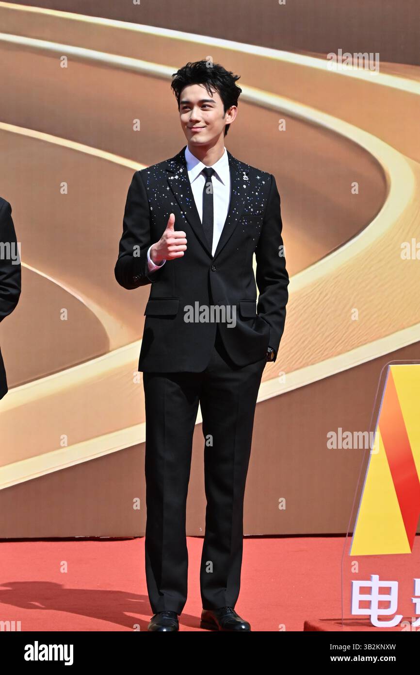 Chinese actor Leo Wu poses on the red carpet at the 20th Huabiao Film ...