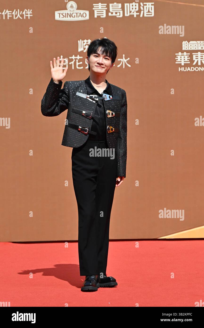 Chinese singer Zhou Shen poses on the red carpet at the 20th Huabiao ...