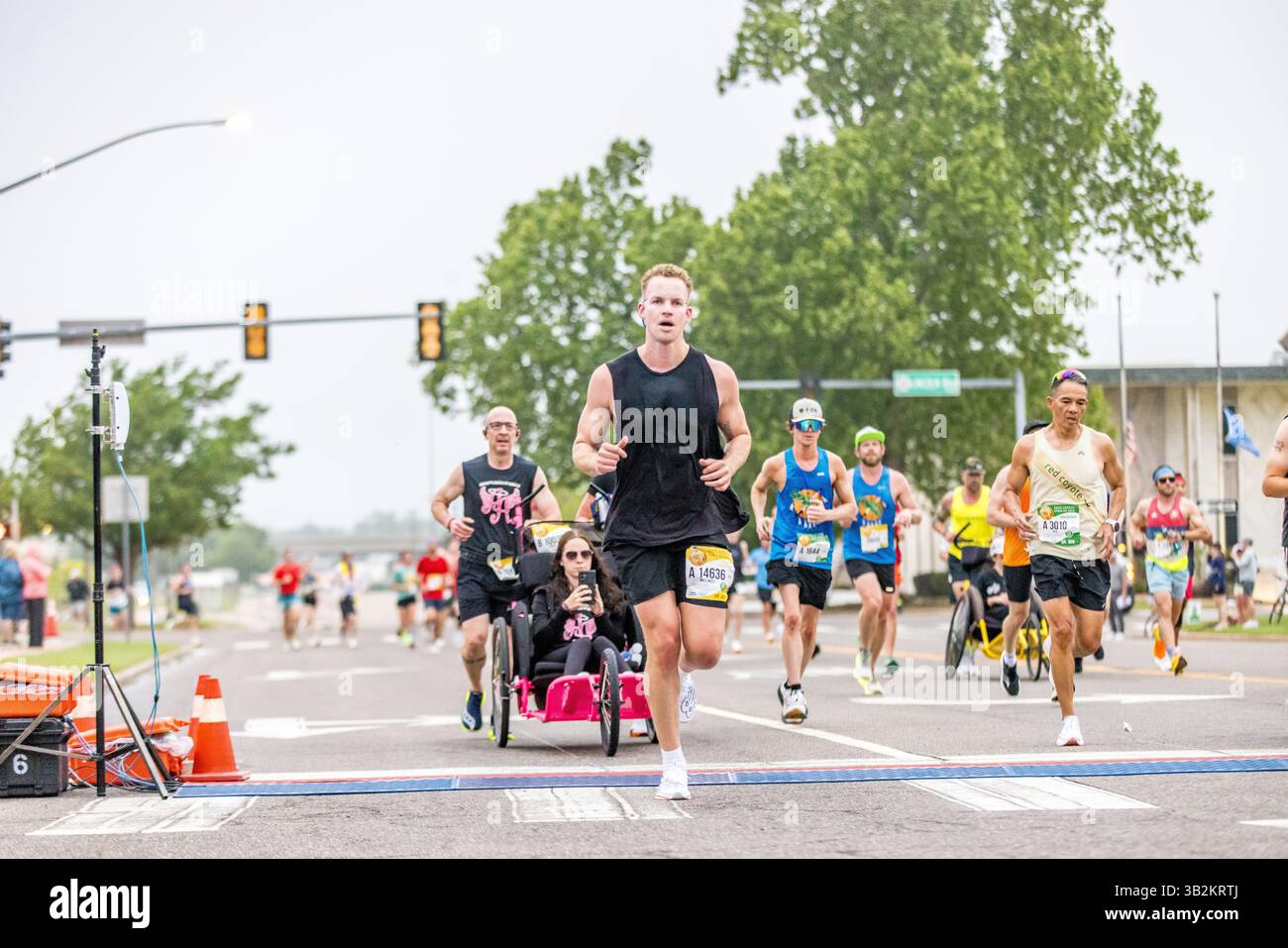 Oklahoma City, United States. 27th Apr, 2025. Runners cross the 5K mark ...