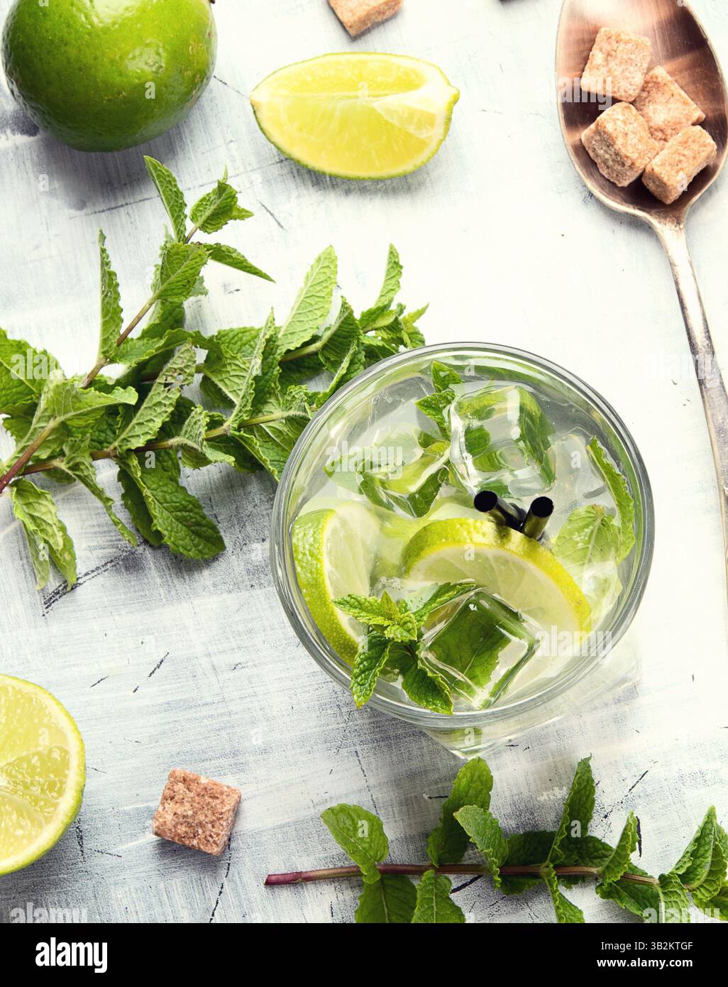 Mojito cocktail drink with lime, mint and sugar. Ready to drink. Top ...