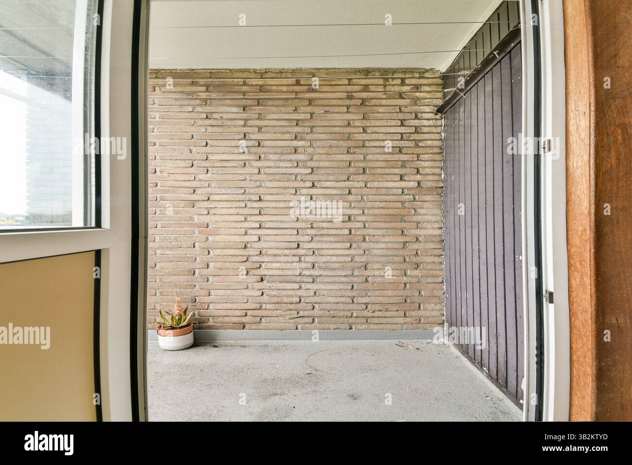 A modern entrance showcasing textured brick walls, a clean floor, and ...